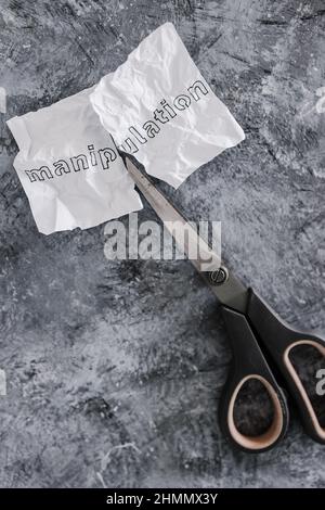 Manipulation text on crumpled piece of paper which is getting cut with ...