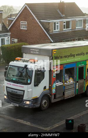 A household recycling waste lorry collects rubbish from homes in ...
