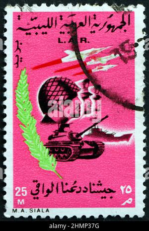 LIBYA - CIRCA 1969: a stamp printed in Libya shows Soldiers, Tanks and ...