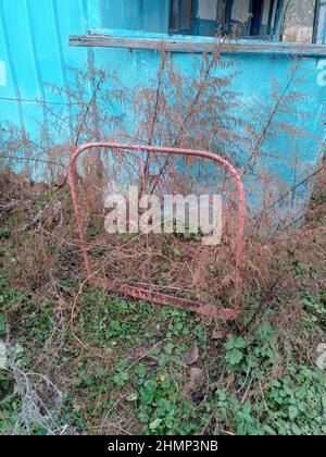Foot cleaner. Metal construction for shoe polishing Stock Photo - Alamy