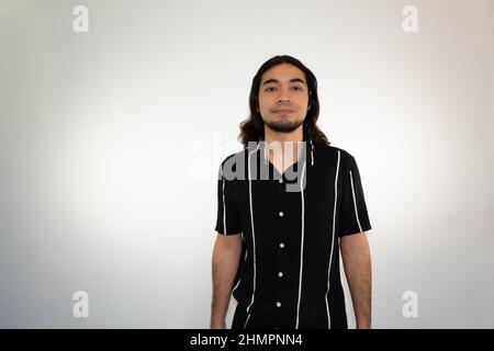portrait of a hispanic non binary man on a white background Stock Photo ...