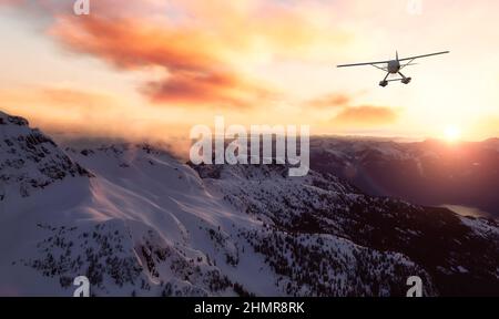 Airplane flying over the beautiful Canadian Landscape during a vibrant ...