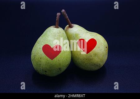 Two pears together with hearts in the middle, relationship concept ...