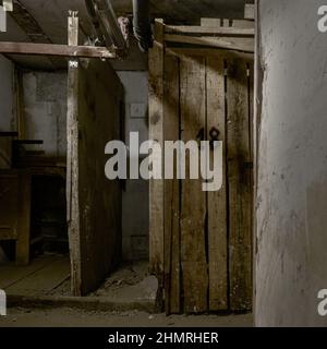 abandoned basement with electricity and sewers in the basement of a ...