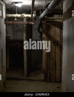 abandoned basement with electricity and sewers in the basement of a ...