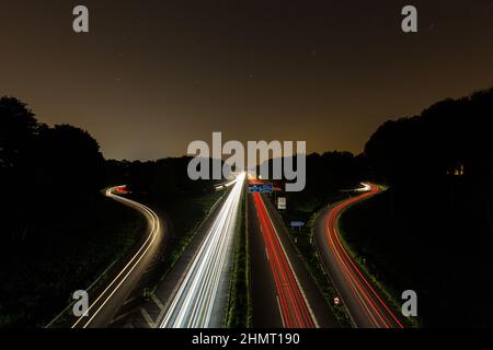 highway crossing with lighttrails at night Stock Photo - Alamy
