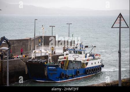 The Clew Bay Queen loading at Roonagh Pier in Mayo bringing cargo and ...