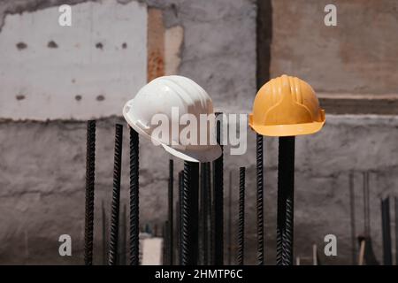 Workers build a stone wall at a site Stock Photo - Alamy