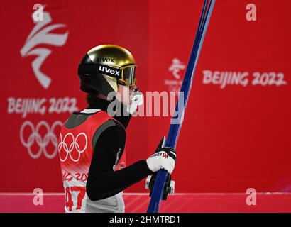 Marius Lindvik, of Norway, celebrates after his second round jump of ...
