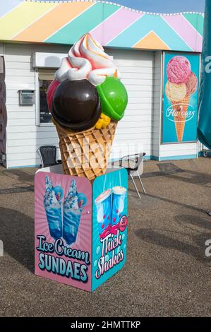 Large ice cream cone advertising display at cafe Stock Photo - Alamy