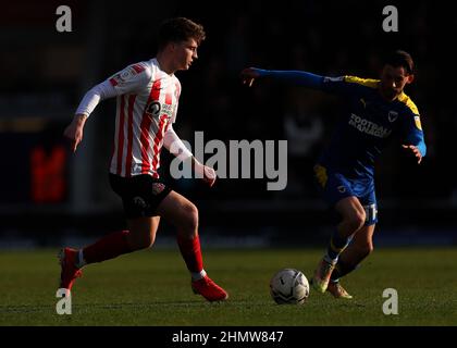 Dennis Cirkin Of Sunderland Under pressure from Jayden Bogle Of Leeds ...