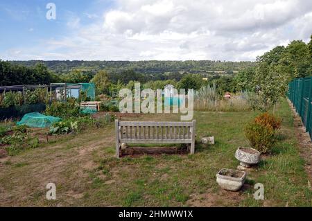 Traditional English Allotment with sheds and plots with trees and view ...