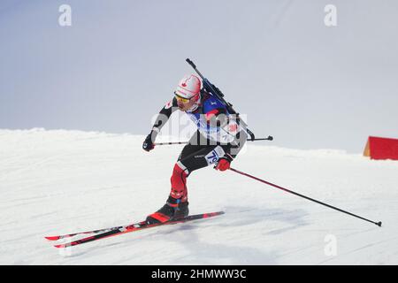 Adam Runnalls, of Canada, competes in the 4X6-kilometer mixed relay ...