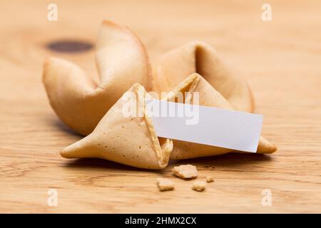 fortune cookies with a note on wooden table Stock Photo - Alamy