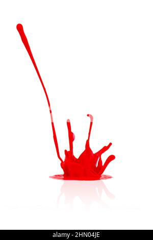 red paint splash isolated on a white background Stock Photo - Alamy