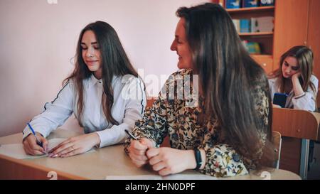 Group of children coming out of school Stock Photo - Alamy