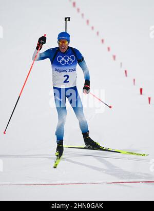 Quentin Fillon Maillet of France crosses the finish line during the men ...