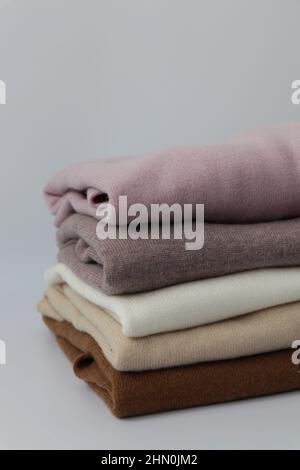 Stack of colorful clothes, on dark background Stock Photo - Alamy