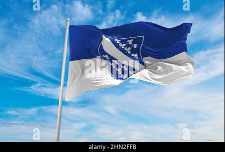 flag of Kassel at cloudy sky background on sunset, panoramic view ...