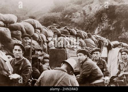 Archival photo of the Spanish Civil War. Troops and armored cars on the ...