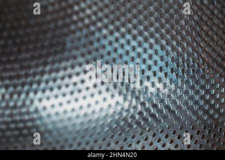 Metal texture with multiple wholes - background Stock Photo - Alamy