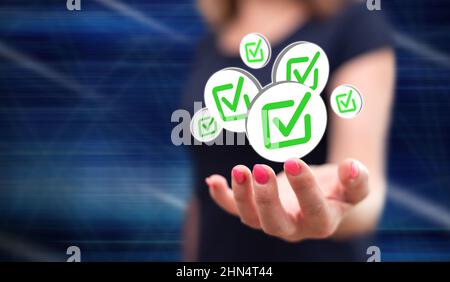 Validation concept above the hand of a woman in background Stock Photo ...