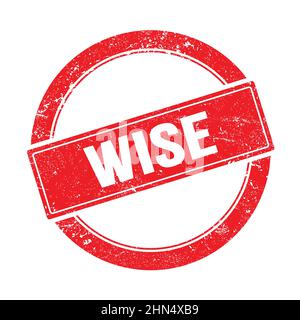 WISE text on red grungy vintage rubber stamp Stock Photo - Alamy