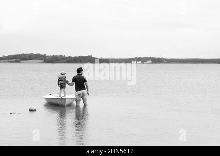 father and son rigging an optimist Stock Photo - Alamy