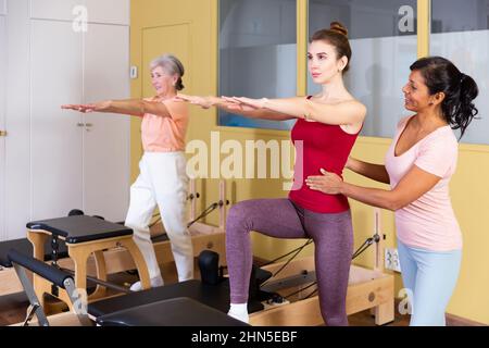 Active women perform exercises with outstretched arms Stock Photo - Alamy