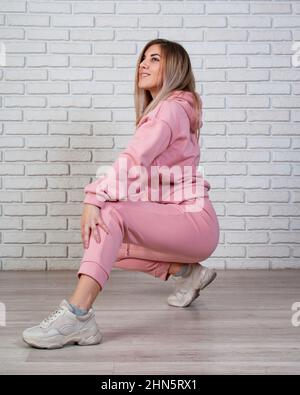 Middle age hispanic sporty woman having online fitness class at sport ...