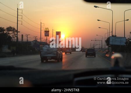 Heading south on Phetkasem Road towards Hua Hin during sunset in ...