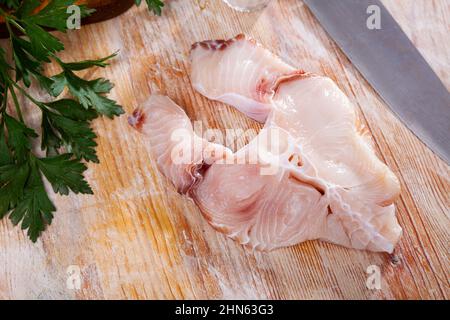 Raw seafood, fresh tiger shark fillet on board Stock Photo - Alamy