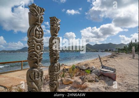 Carved statues erected on the beach of Nettle Bay (/ Baie Nettlé on the ...