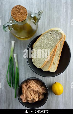 Ingredients to make greek fish roe dip ,known as taramosalata on black ...