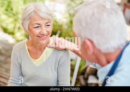 So much more to come. a happy senior couple looking out a window ...