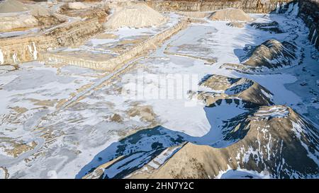 Snow covered rock quarry Stock Photo - Alamy