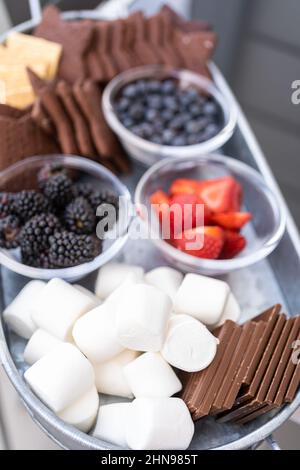 S'mores charcuterie board with fruits and star-shaped graham crakers ...