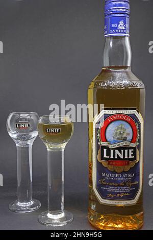 Linie Aquavit bottle and two glasses Stock Photo - Alamy