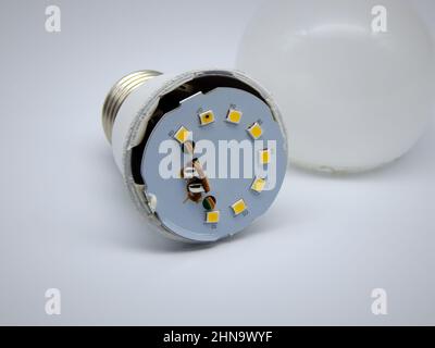 Burnt out LED in the lamp. Close-up. On white background Stock Photo ...
