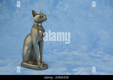 Egyptian cat on blue Stock Photo - Alamy