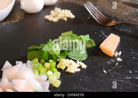Chopped green garlic on a cutting board with knife Stock Photo - Alamy