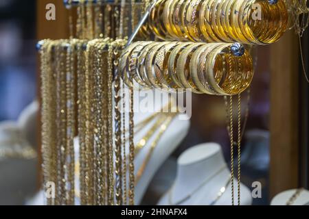 Jewelry shop window with a huge selection of gold jewelry bracelets ...