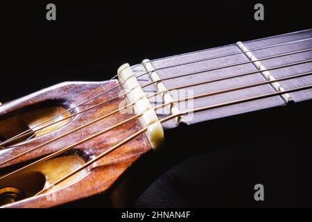 Details of a zero fret on acoustic guitar, closeup view Stock Photo - Alamy