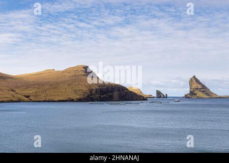 View of the coast near Bour on the island of Vagar. Massive cliffs ...