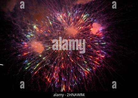 Scenic view of lots of vivid fireworks glowing in a dark sky Stock ...