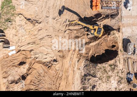 Aerial photo of excavator on industrial place. Industrial site top view ...