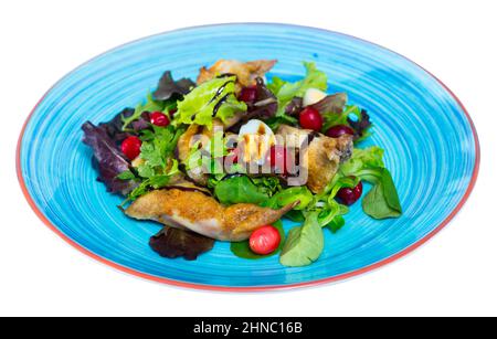 Salad with quail, berries and sauce Stock Photo - Alamy