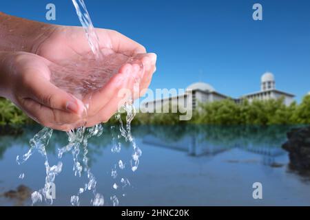 Muslim hands taking ablution before praying Stock Photo - Alamy