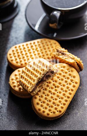 Sweet sandvich cookies. Biscuits with cocoa cream filling on kitchen ...