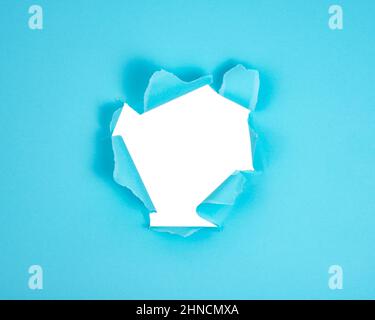 Blue torn paper whole with copyspace Stock Photo - Alamy